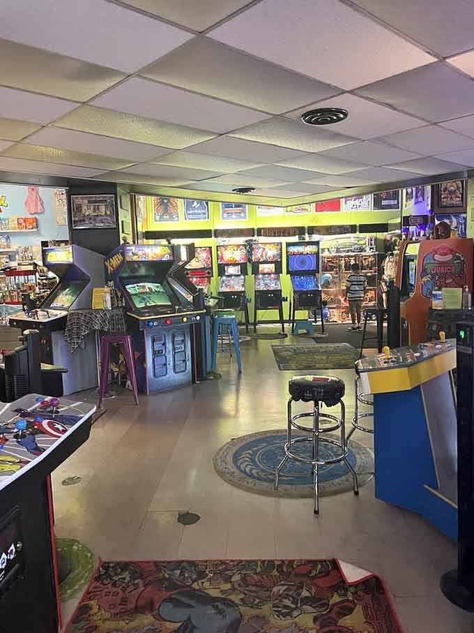 Rows of classic arcade cabinets stand ready like old friends, their glowing screens promising hours of nostalgic fun.