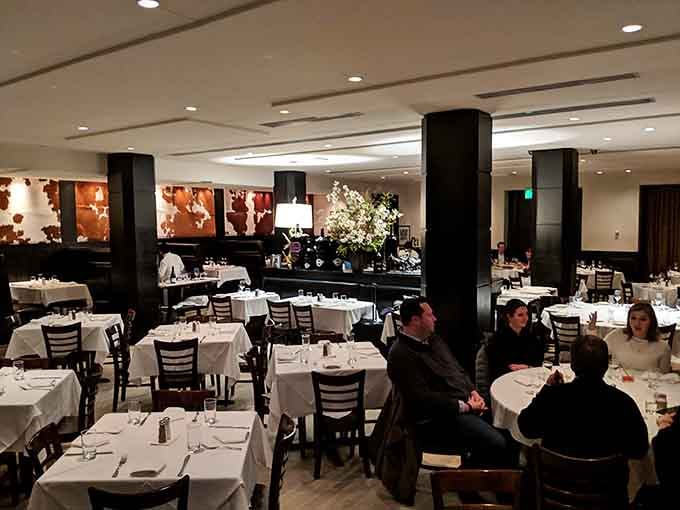 White tablecloths and warm lighting create the kind of atmosphere where celebrations feel even more special than usual.