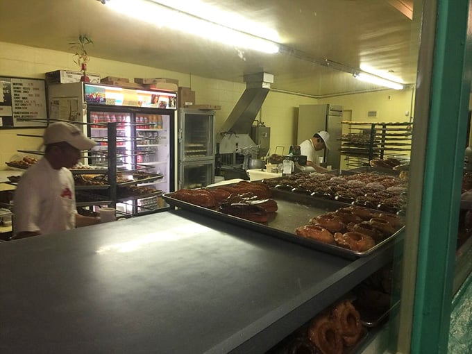 Fresh maple bars cooling on trays, waiting to make someone's morning infinitely better than they imagined possible.