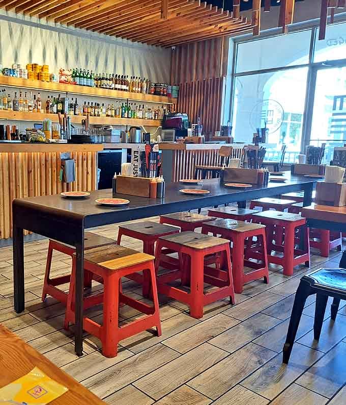 Bright red stools and warm wood create the perfect backdrop for serious slurping and happy eating.
