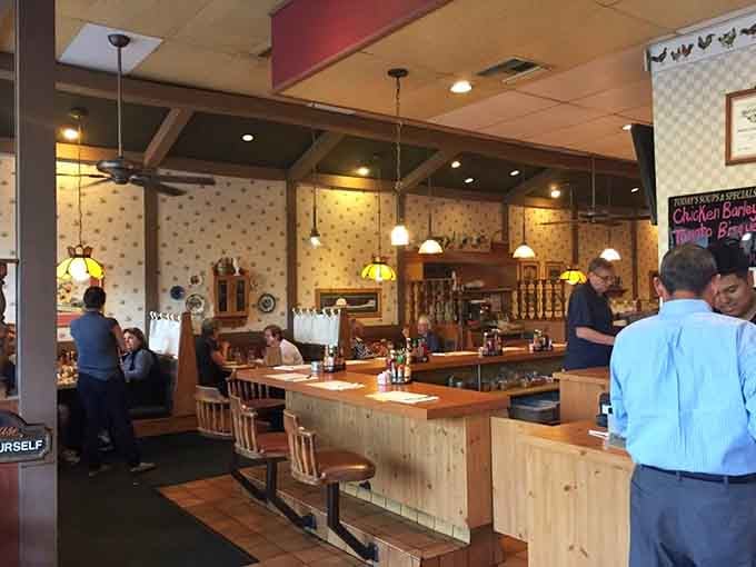 Classic booth seating and warm lighting create the perfect stage for pot pie performances daily.