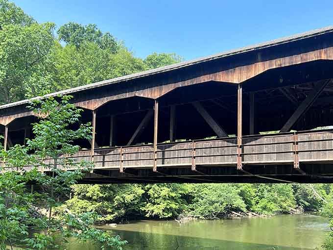 This covered bridge isn't just Instagram bait; it's a genuine slice of Ohio craftsmanship spanning crystal-clear water.