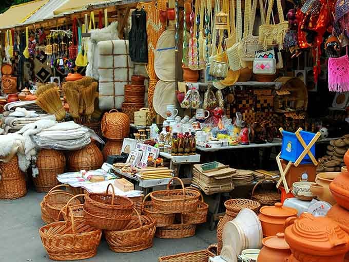 Baskets, pottery, and handcrafted goods overflow in glorious abundance, proving one person's clutter is another's decorating goldmine.