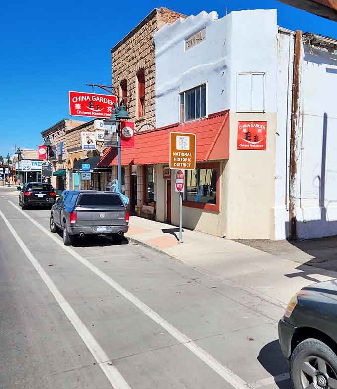 Historic storefronts wear their age proudly, mixing brick charm with practical small-town businesses that actually survive.