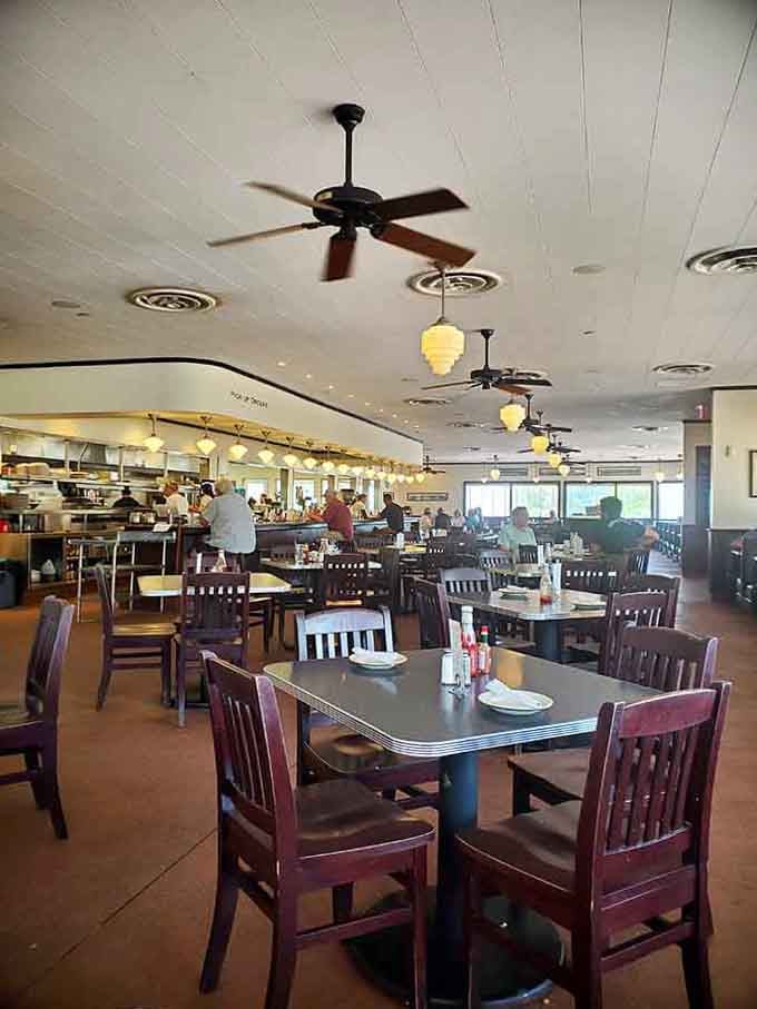 Inside, chrome and comfort meet under ceiling fans that have witnessed countless perfect meals being served.