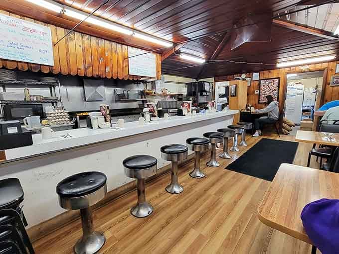 Classic diner stools line the counter where magic happens, one foot-wide pancake at a time.