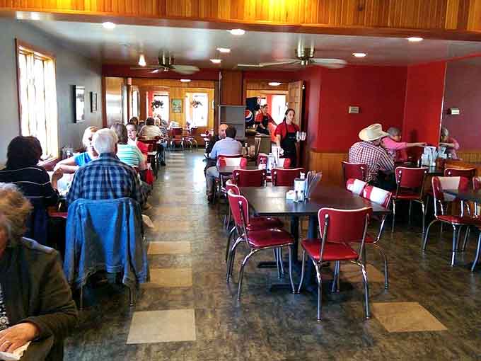 Red chairs and warm lighting create the perfect setting for serious pie contemplation and life-changing dessert decisions.