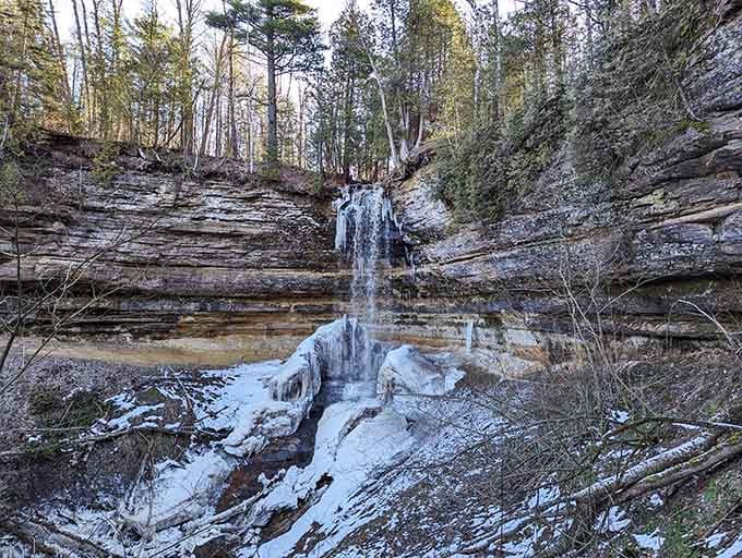 Winter transforms this cascade into a frozen masterpiece that belongs in a fantasy film, not Michigan.