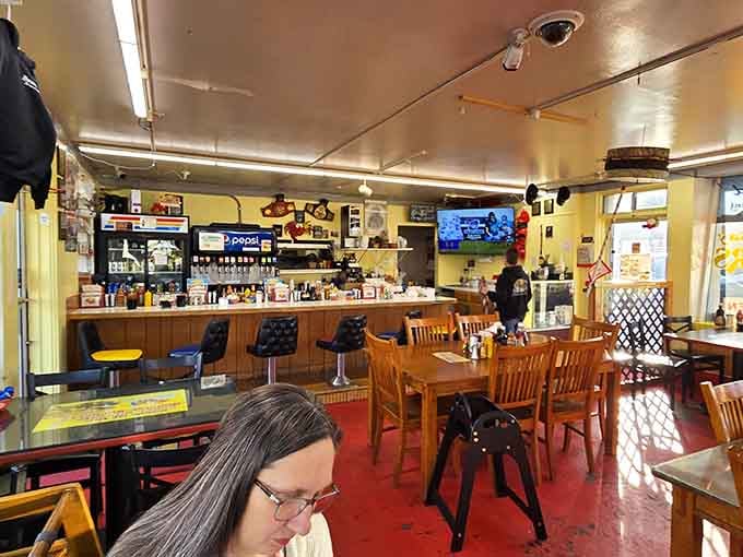 Classic diner counter seating where the coffee's always hot and the conversations flow as freely as the maple syrup.