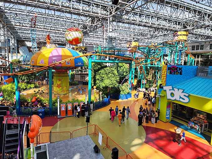 Roller coasters weaving through a mall like someone dared architecture to get creative and it actually delivered.