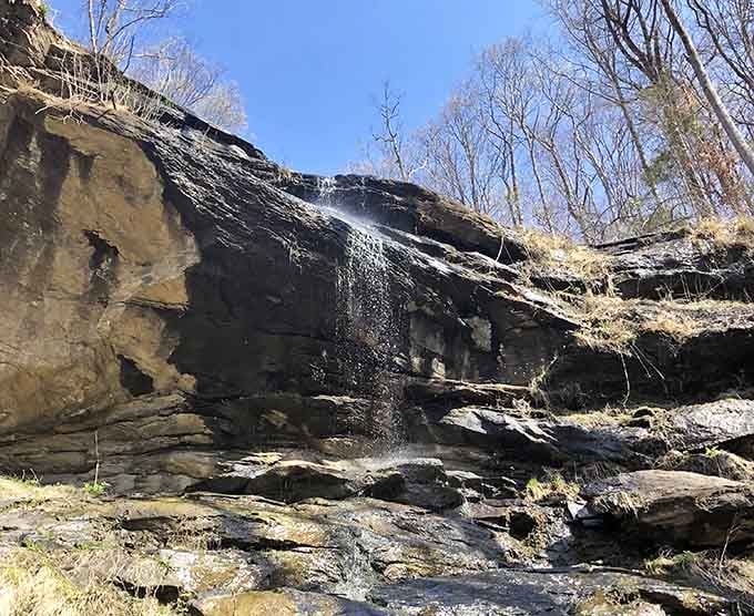 When water decides to put on a show, even a modest 50-foot rock wall becomes nature's own theater production.