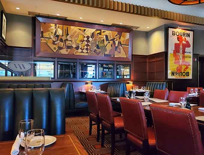 Rich leather booths and vintage posters create an atmosphere where Mad Men characters would feel right at home.