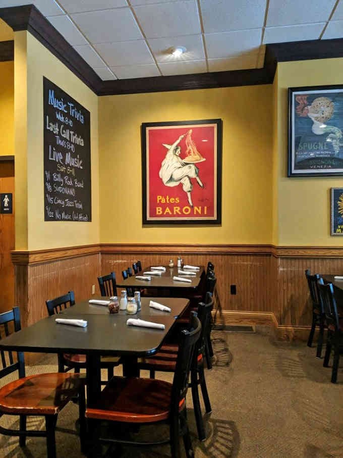 Vintage posters and warm lighting create the kind of atmosphere where every meal feels special.