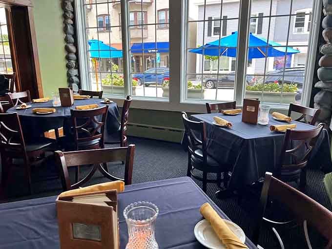 Window seats with a view, crisp linens, and the promise of an unforgettable meal ahead.