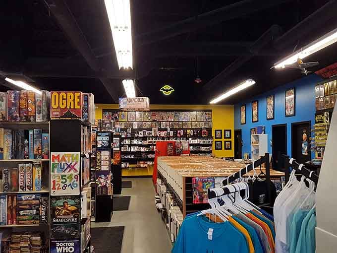 Bright yellow and blue walls create an energetic atmosphere where board games and comics live in perfect harmony.