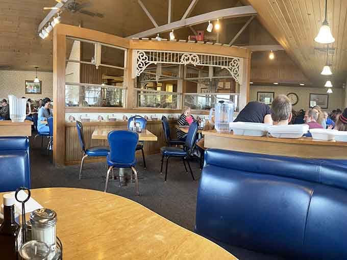 High ceilings, cozy booths, and that decorative archway create a welcoming space that feels both spacious and wonderfully unpretentious.