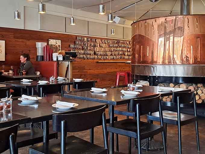 The gleaming copper oven steals the show, turning out masterpieces while you watch the magic unfold.