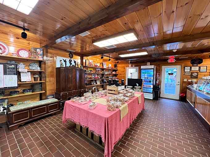 Wood paneling and pink tablecloths create the kind of warmth that makes strangers feel like family instantly.