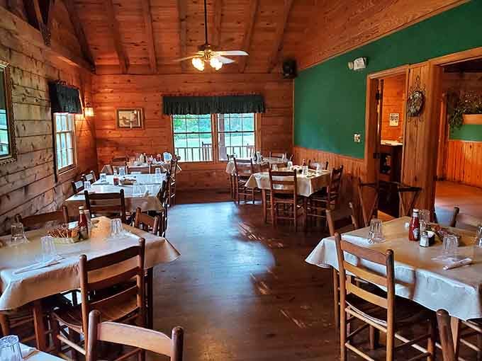 Wood-paneled walls and white tablecloths create the perfect balance between rustic charm and genuine dining elegance.
