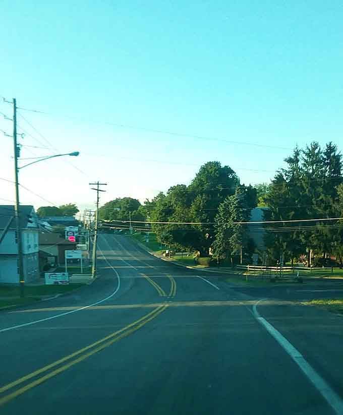 Small-town roads where the speed limit is more suggestion than rule, and neighbors still wave from their porches.