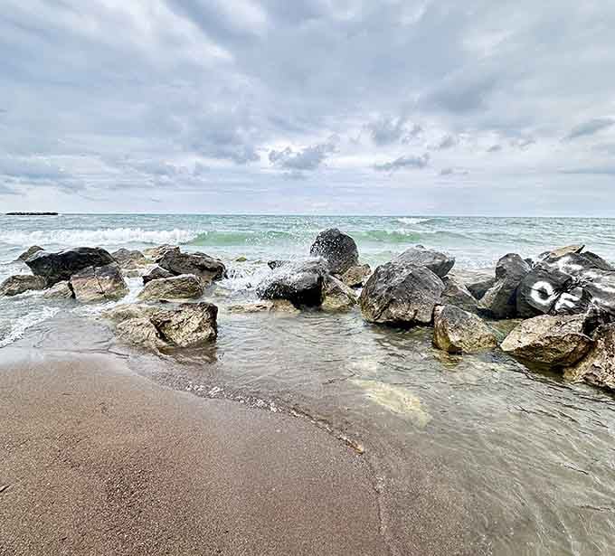 Lake Erie's rocky breakwaters create their own little ecosystem where waves meet stone in an endless, mesmerizing dance.