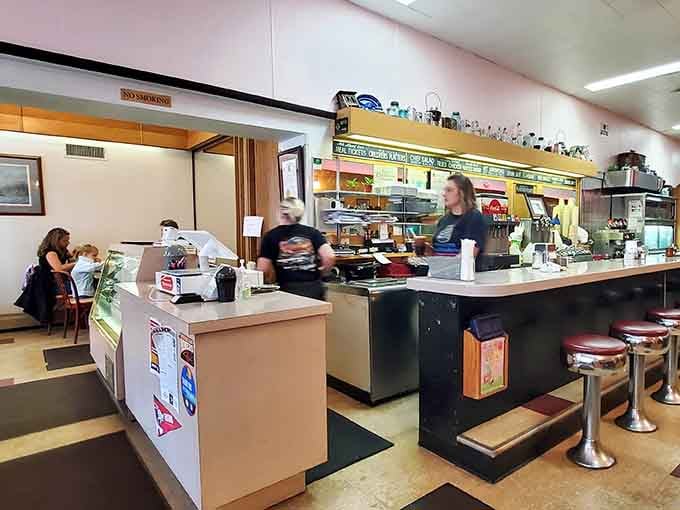 Counter seating where locals have solved the world's problems over coffee for generations, one refill at a time.