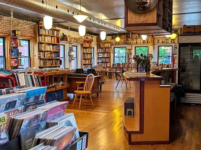 Exposed brick, warm wood floors, and endless shelves create the kind of atmosphere where time simply stops mattering.