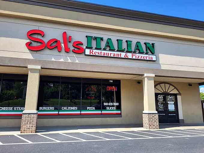 That "OPEN" sign glowing in the window means fresh calzones and pizza are just steps away, friend.