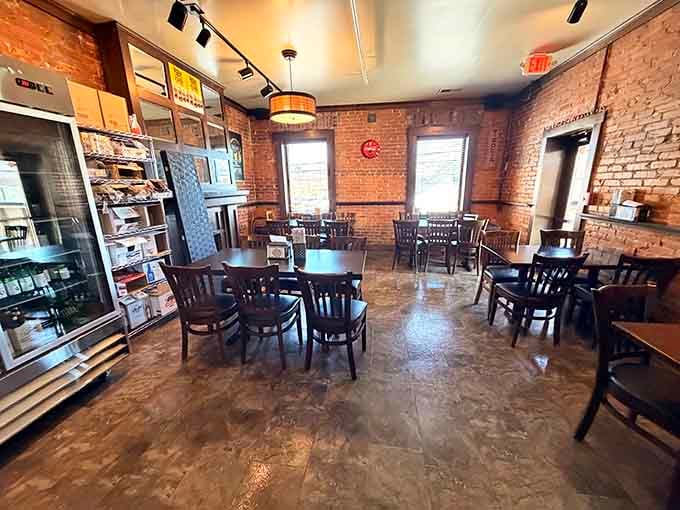 Exposed brick and polished floors create an atmosphere where comfort food meets contemporary style beautifully.