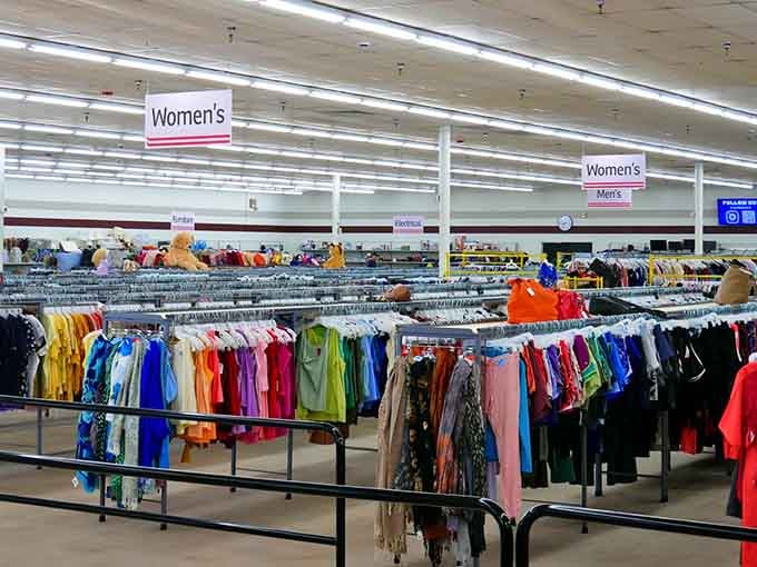 Rows of clothing stretching to infinity, organized by color like a thrifter's fever dream come true.