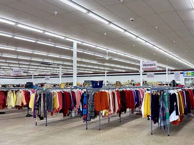 Color-coded racks stretch endlessly, making shopping feel less like work and more like a rainbow expedition.