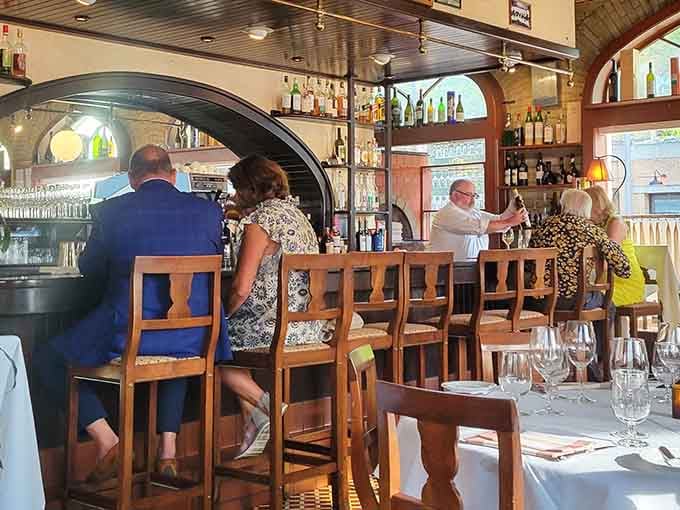 Those arched ceilings once echoed with beer-making, now they frame conversations over handmade pasta and Italian wine.