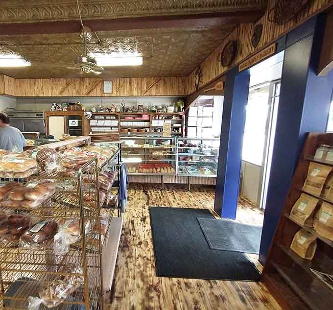 Wood paneling, tin ceiling, and display cases bursting with baked goods create the coziest carbohydrate cathedral you'll ever visit.