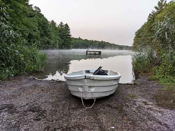 Morning mist and a trusty rowboat, ready to deliver the kind of peace money can't buy.