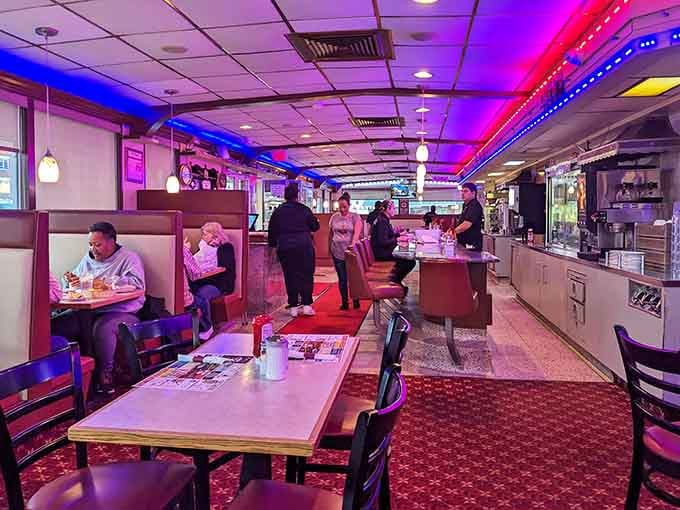 Neon lights and booth seating create the perfect atmosphere for solving life's problems over pancakes.