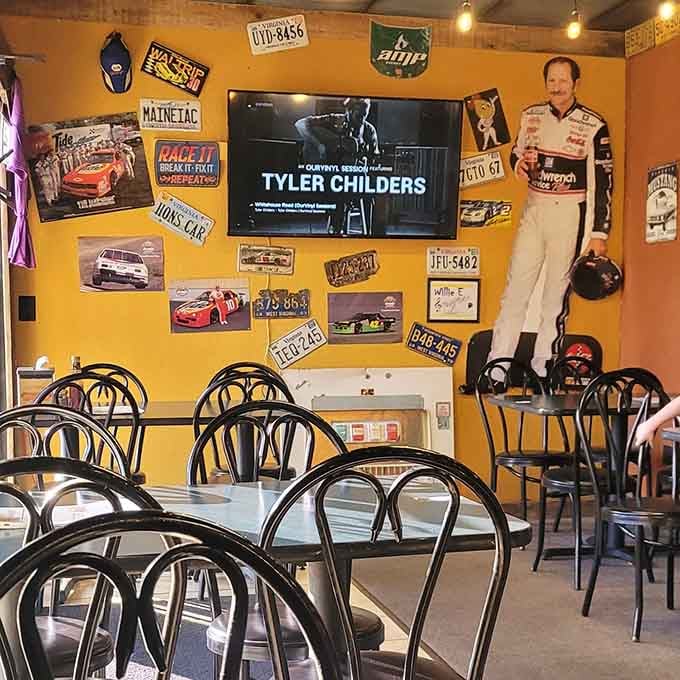 Yellow walls and racing memorabilia create the perfect backdrop for devouring hot dogs without pretense or apology.