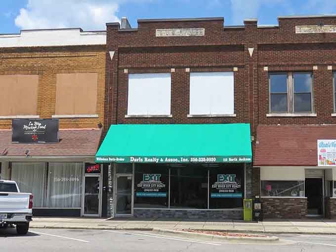 These historic storefronts have witnessed decades of community life, standing proud like seasoned veterans of small-town commerce.