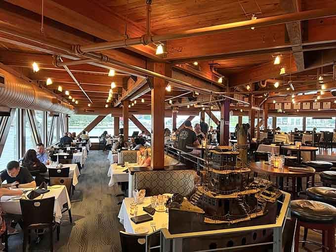 Exposed beams and harbor views create a dining room that feels like a captain's favorite secret spot.