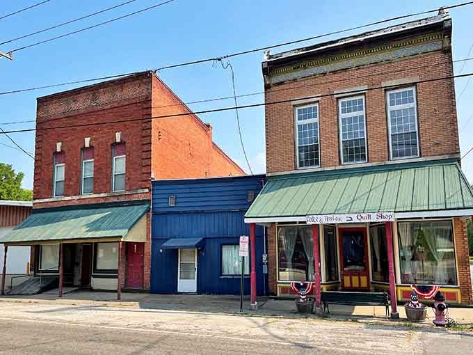 Classic small-town storefronts with patriotic bunting remind you that authentic America still exists beyond the interstate exits.