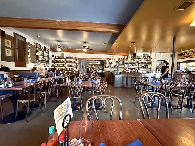 Exposed beams and warm lighting create the kind of cozy atmosphere where strangers become brunch buddies.