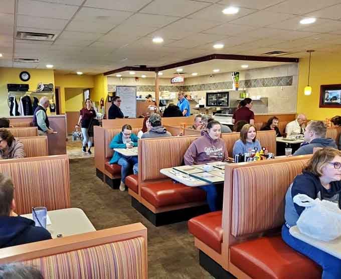 Cozy booths and cheerful yellow walls create the perfect setting for serious comfort food conversations.