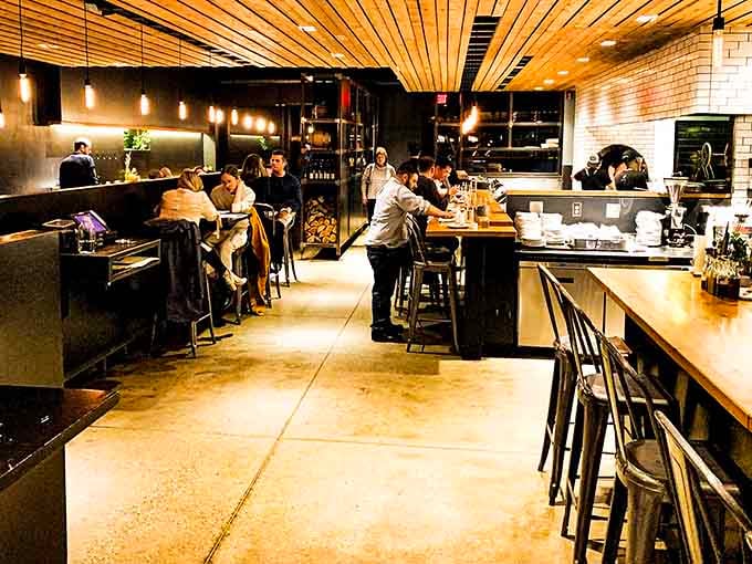 Those pendant lights aren't just for ambiance, they're making sure everyone can see exactly what they're about to devour.