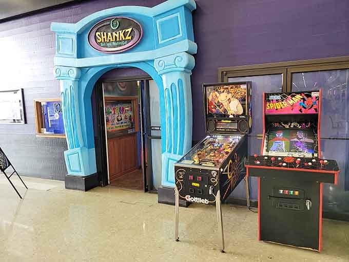 That turquoise entrance promises adventure, and those vintage arcade machines deliver instant nostalgia before you even grab a putter.