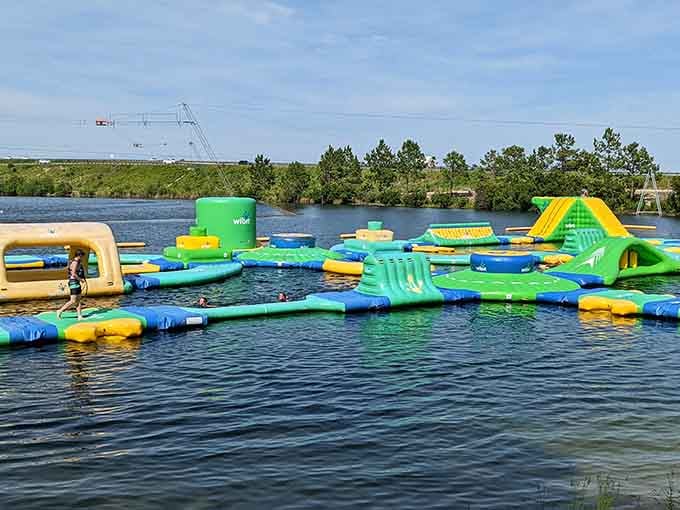When blue and green inflatables meet calm water, adults suddenly remember what "recess" used to feel like.