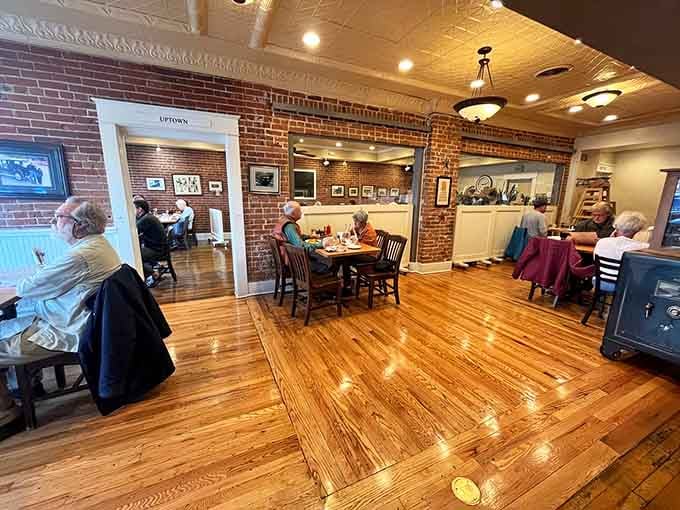 Exposed brick, warm wood floors, and natural light create the kind of atmosphere where strangers become friends over coffee.