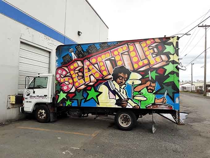 Even the delivery trucks get the street art treatment, proving this place understands music's cultural impact.