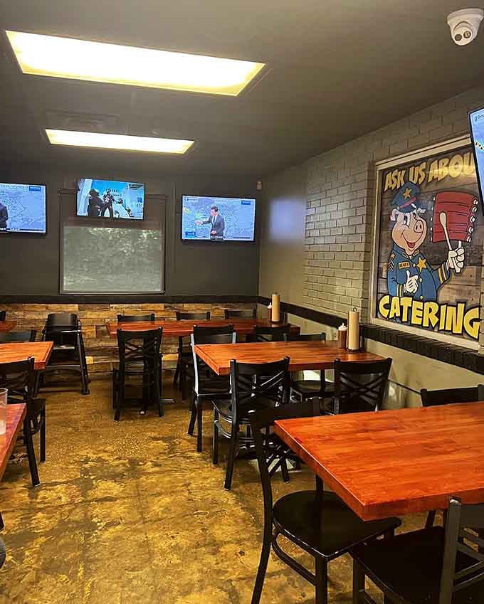 Simple tables, multiple TVs, and zero pretension create the perfect backdrop for serious barbecue consumption.
