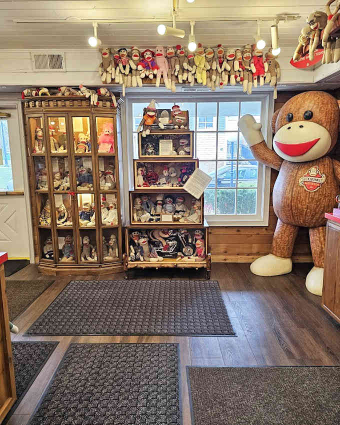That life-sized greeter monkey knows exactly what you need: pure, unfiltered joy in fabric form.