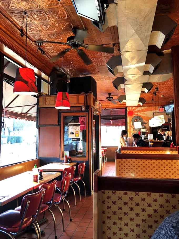 Retro meets modern in this eclectic space where tin ceilings and vintage vibes create the perfect dining atmosphere.