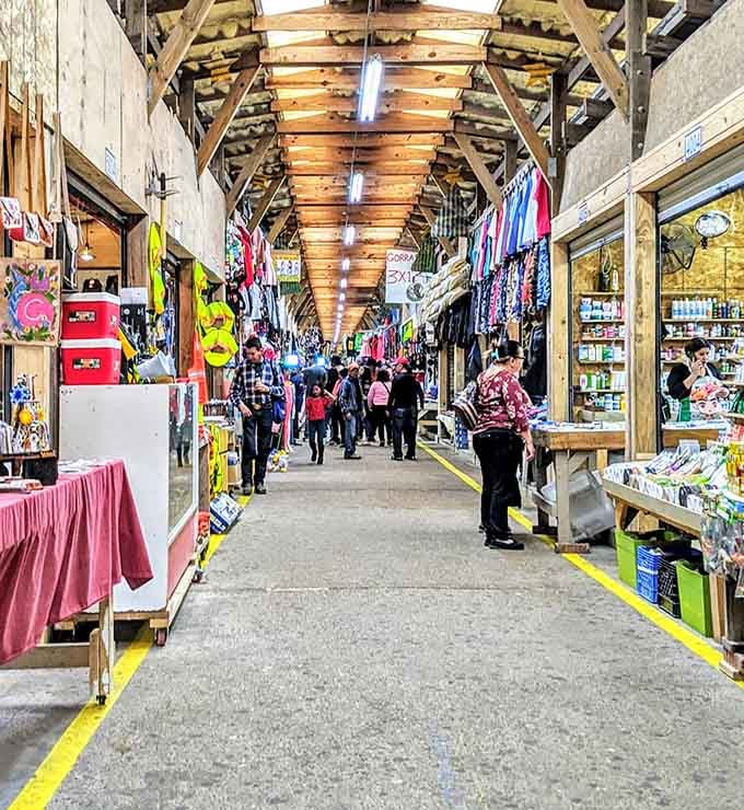 The wooden ceiling beams guide shoppers down bustling aisles where every turn reveals another delightful discovery waiting.